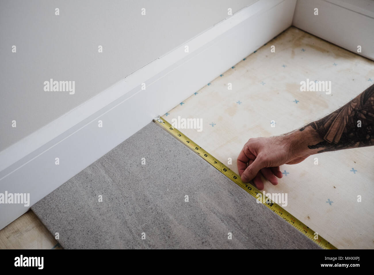 Measuring tile hi-res stock photography and images - Alamy