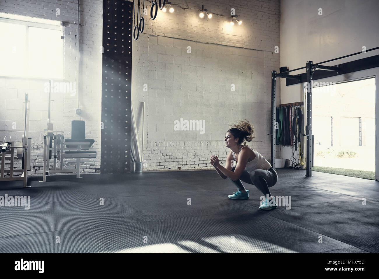 Woman squats in gym hi-res stock photography and images - Alamy
