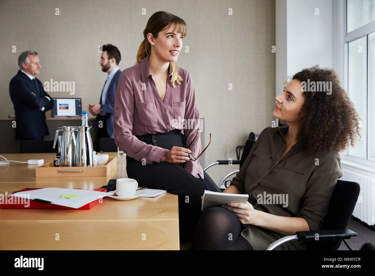 Chatting sitting office hi-res stock photography and images - Alamy