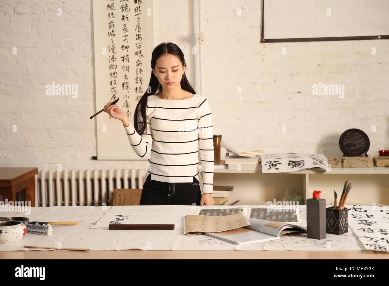Young women to learn calligraphy Stock Photo - Alamy