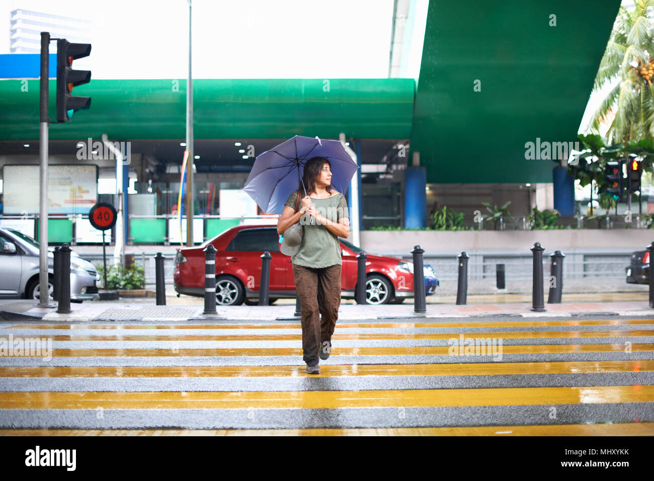 Indian woman crossing street hi-res stock photography and images - Alamy