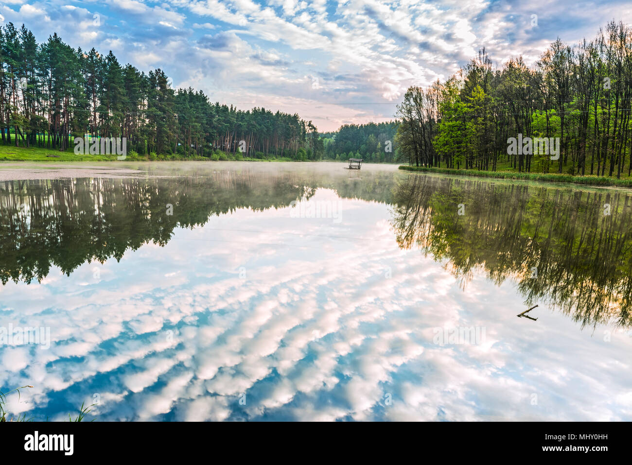 lake landscape with cloud reflections Stock Photo - Alamy