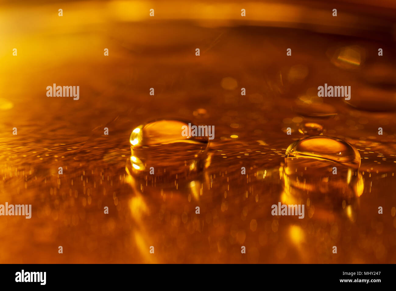 Oil drops and bubbles on a metal gear engine surface. Closeup photo ...