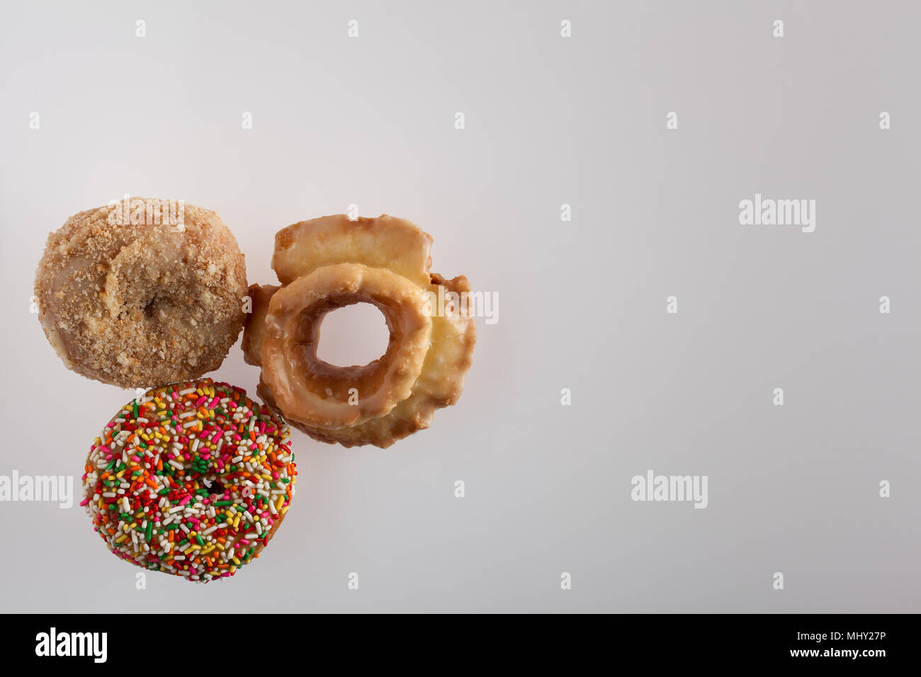 donuts of various size color and shape. copy space in frame Stock Photo ...