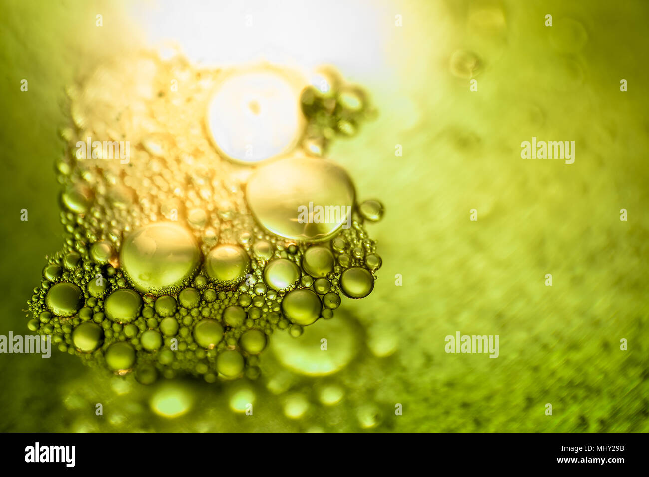 Oil drops and bubbles on a metal gear engine surface. Closeup photo ...