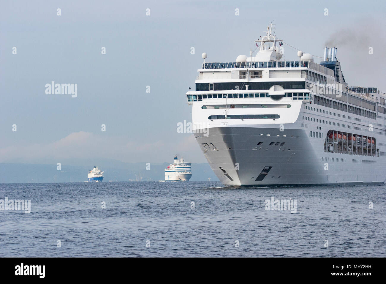 container vessel and ferry on high sea Stock Photo - Alamy