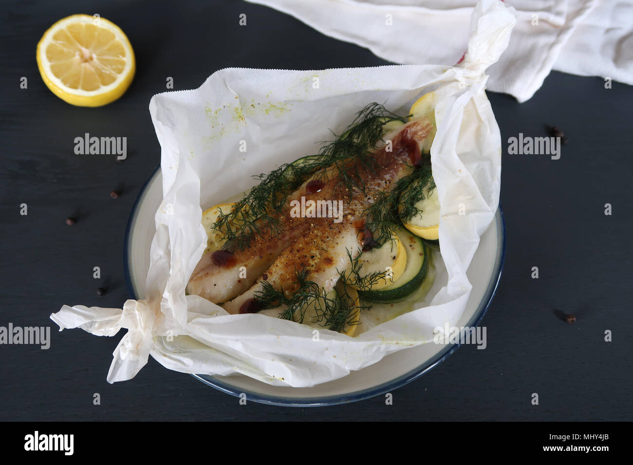 Fish En Papillote Fish baked in Parchment Paper Stock Photo - Alamy