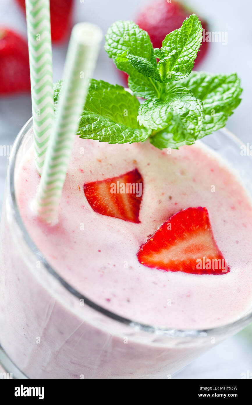 Glass of sweet and refreshing strawberry milkshake Stock Photo - Alamy