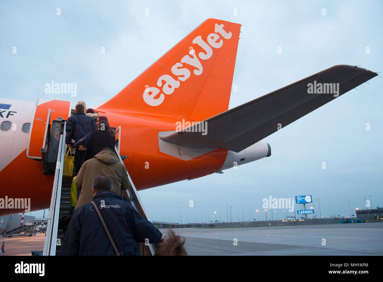 Passengers boarding an Easyjet flight at Schiphol Airport in Amsterdam ...