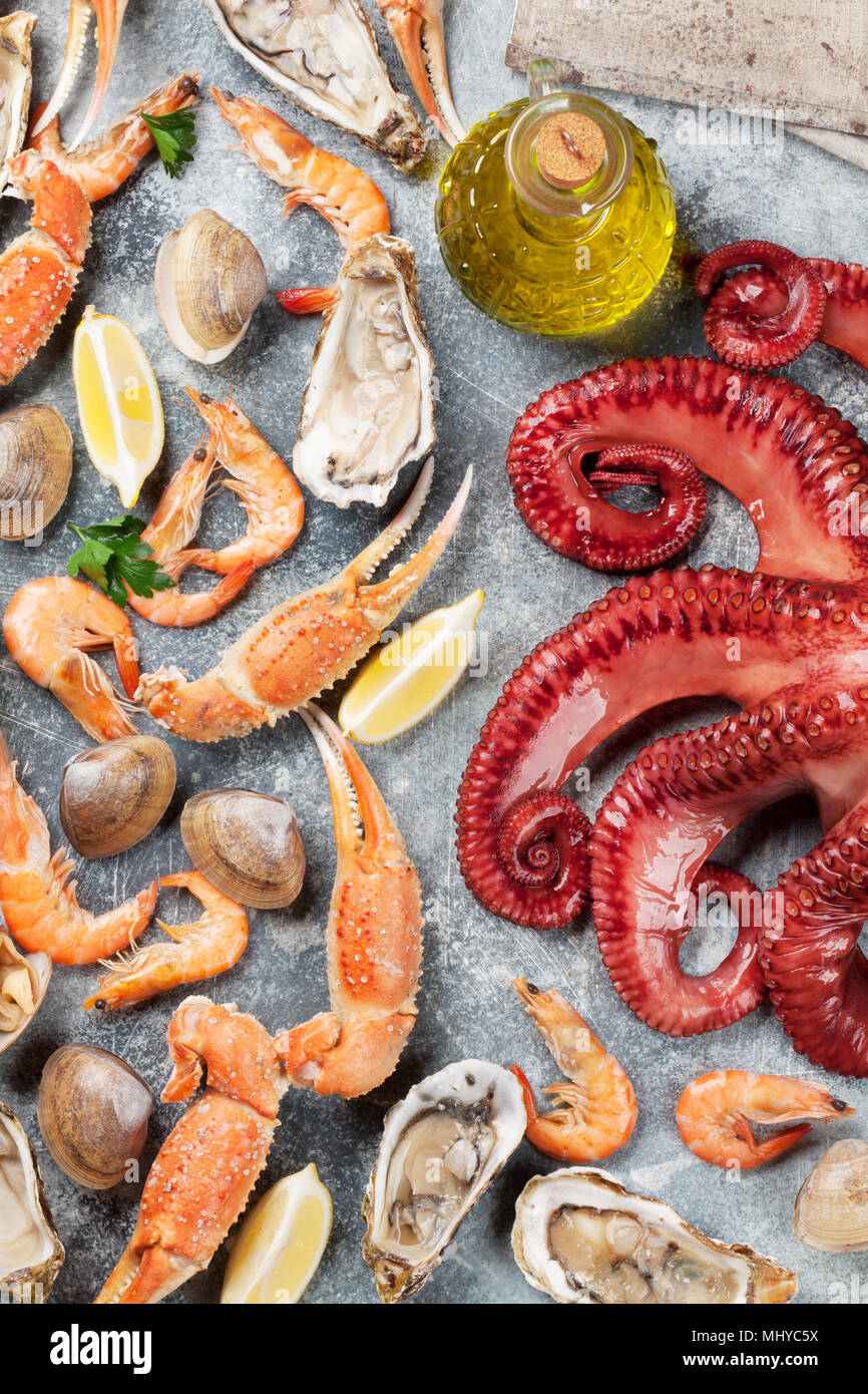 Seafood. Octopus, oysters, lobster, shrimps, clams cooking. Top view ...