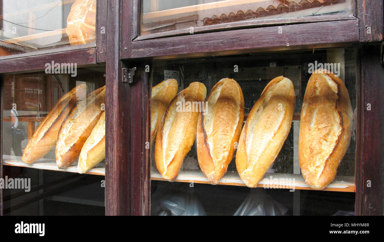Fresh bread on shelves in bakery Stock Photo - Alamy