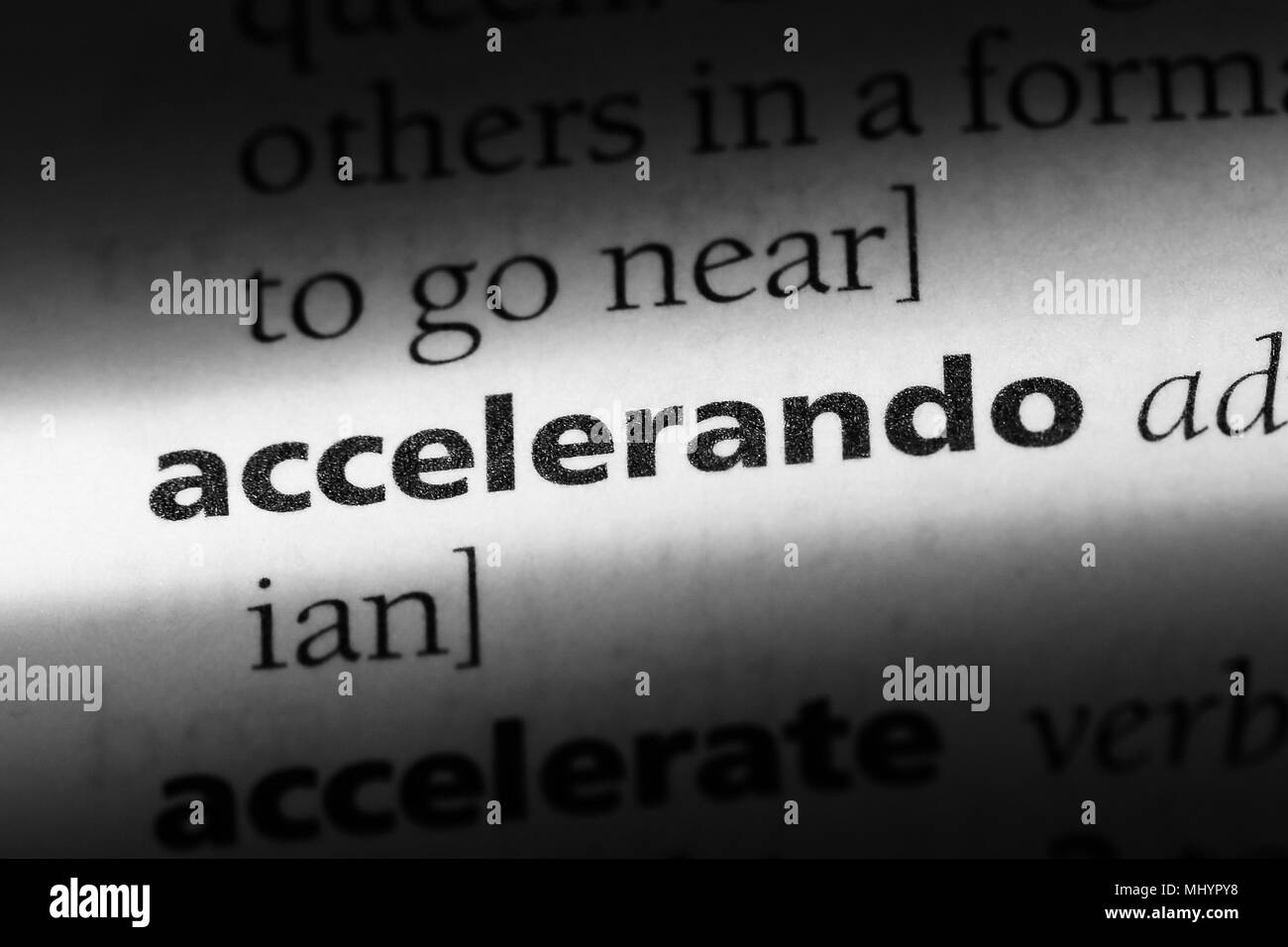 accelerando word in a dictionary. accelerando concept Stock Photo - Alamy