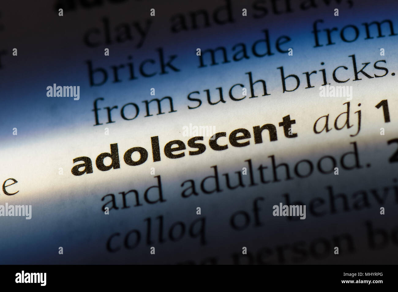 adolescent word in a dictionary. adolescent concept Stock Photo - Alamy
