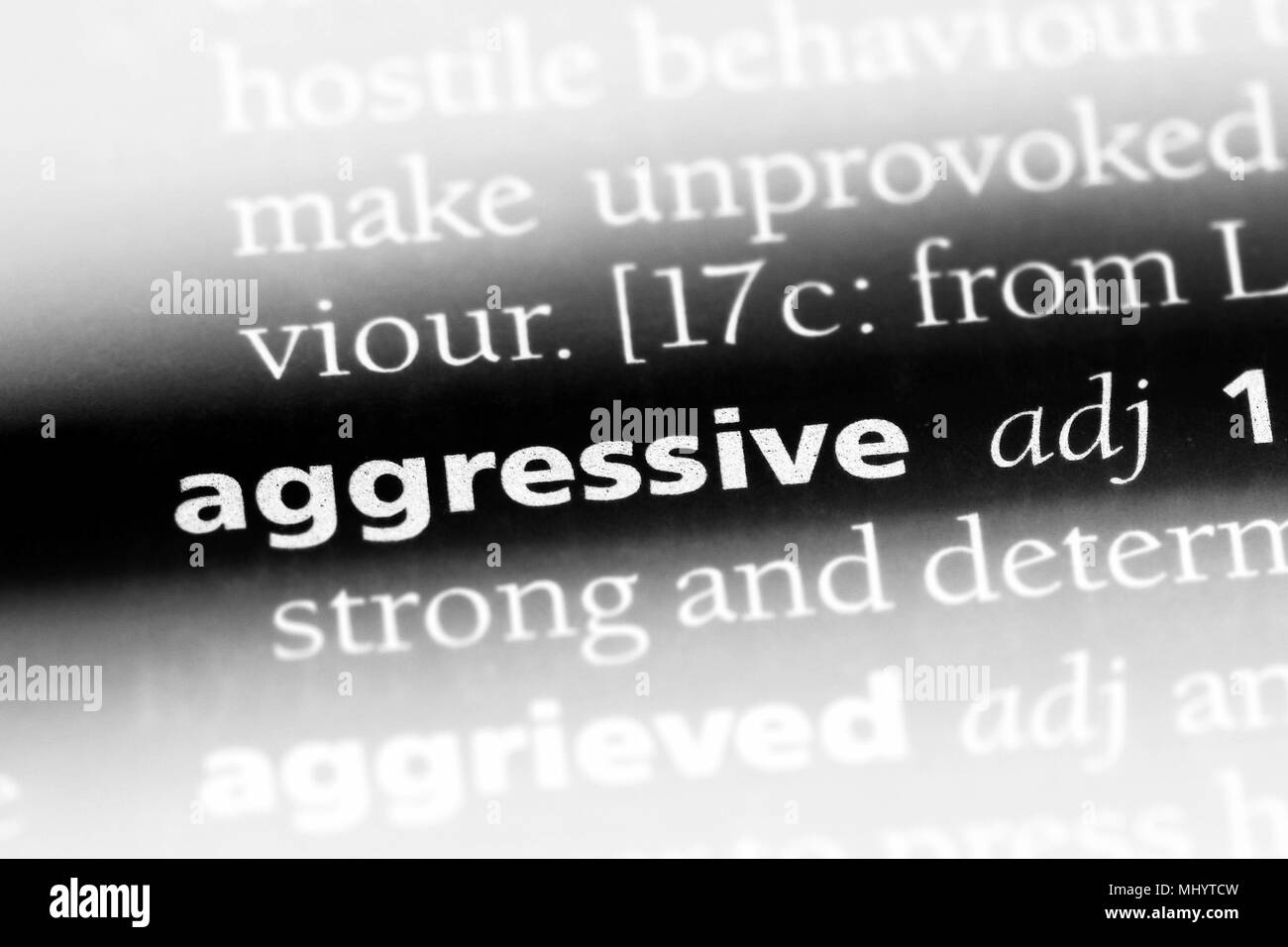 aggressive word in a dictionary. aggressive concept Stock Photo - Alamy