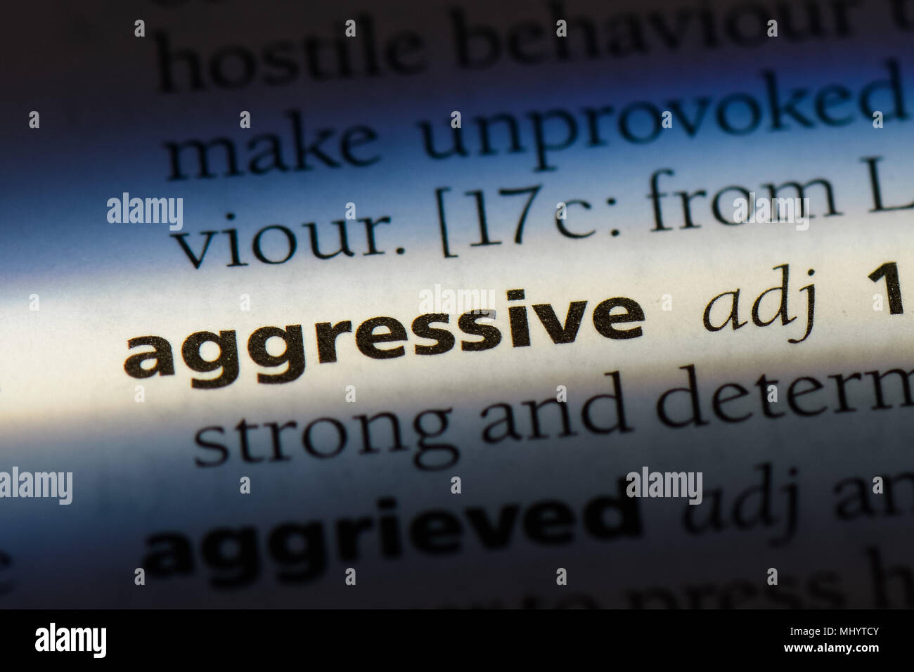 aggressive word in a dictionary. aggressive concept Stock Photo - Alamy