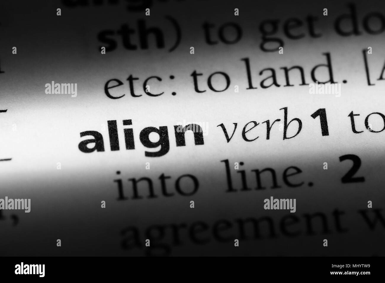 align word in a dictionary. align concept Stock Photo - Alamy