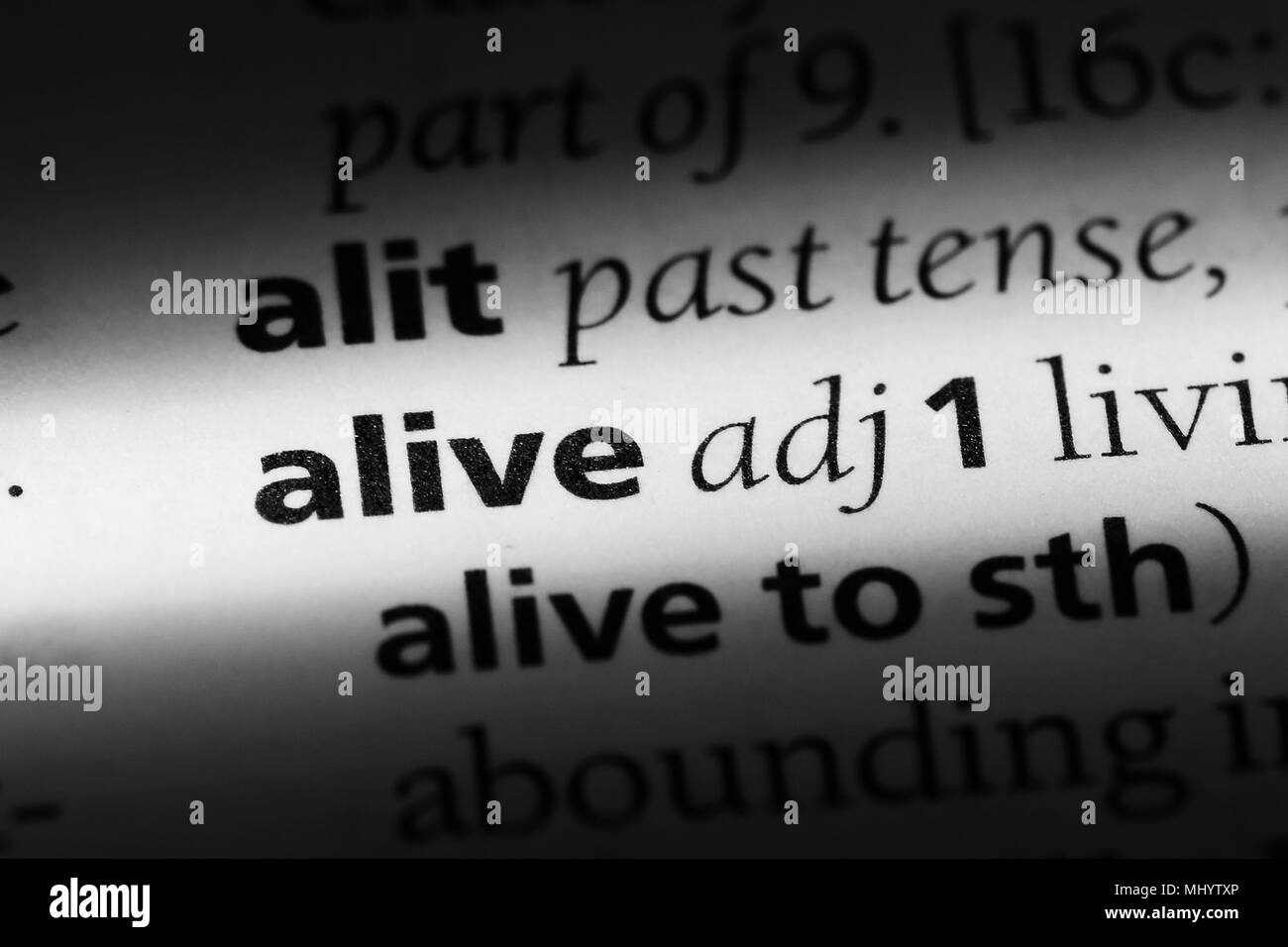 alive word in a dictionary. alive concept Stock Photo - Alamy