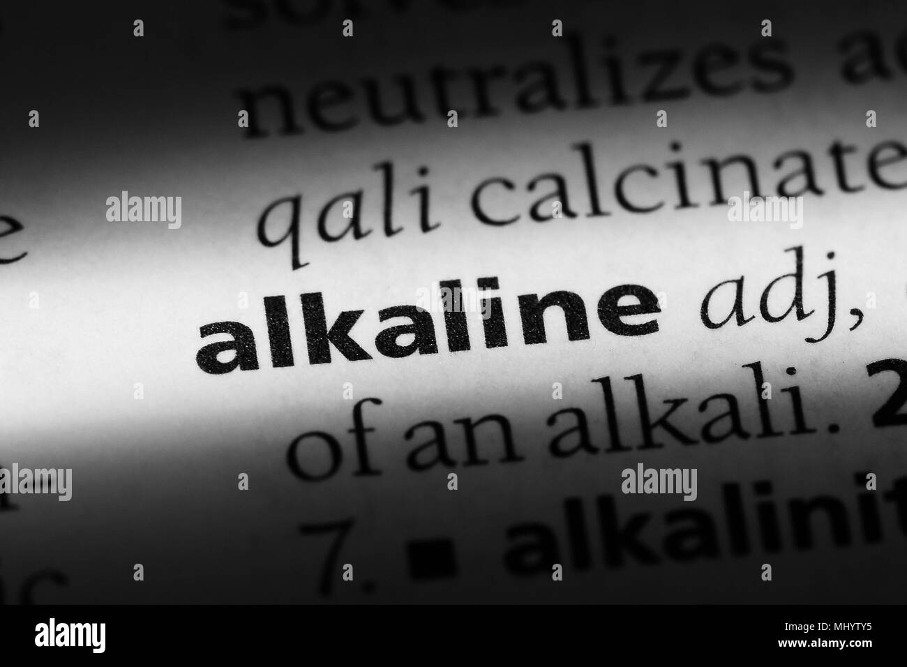 alkaline word in a dictionary. alkaline concept Stock Photo - Alamy
