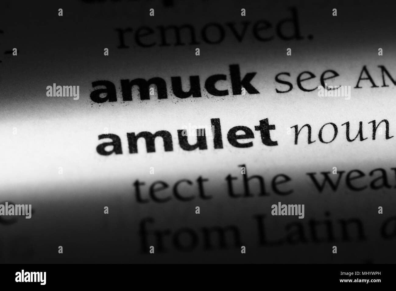 amulet word in a dictionary. amulet concept Stock Photo - Alamy