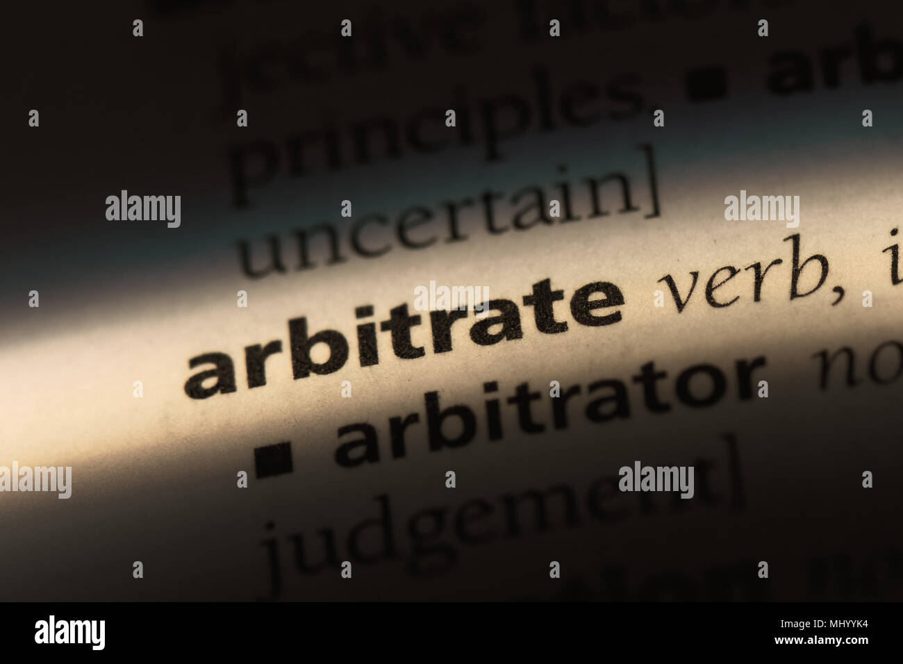 arbitrate word in a dictionary. arbitrate concept Stock Photo - Alamy