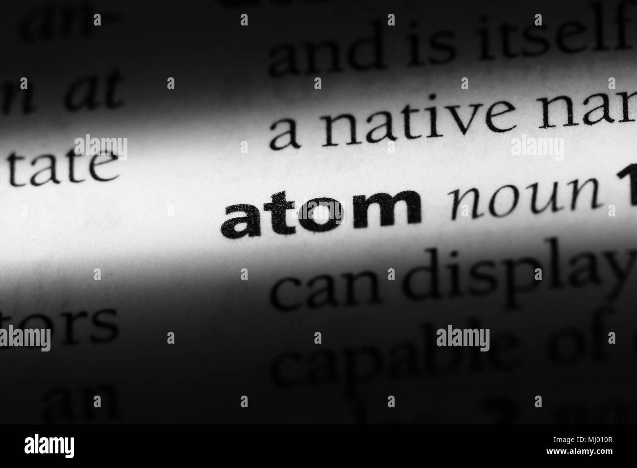 atom word in a dictionary. atom concept Stock Photo - Alamy