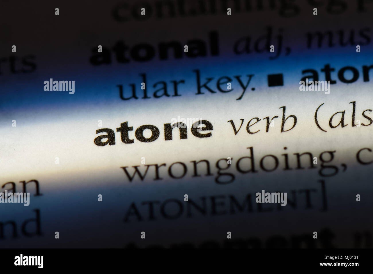 atone word in a dictionary. atone concept Stock Photo - Alamy