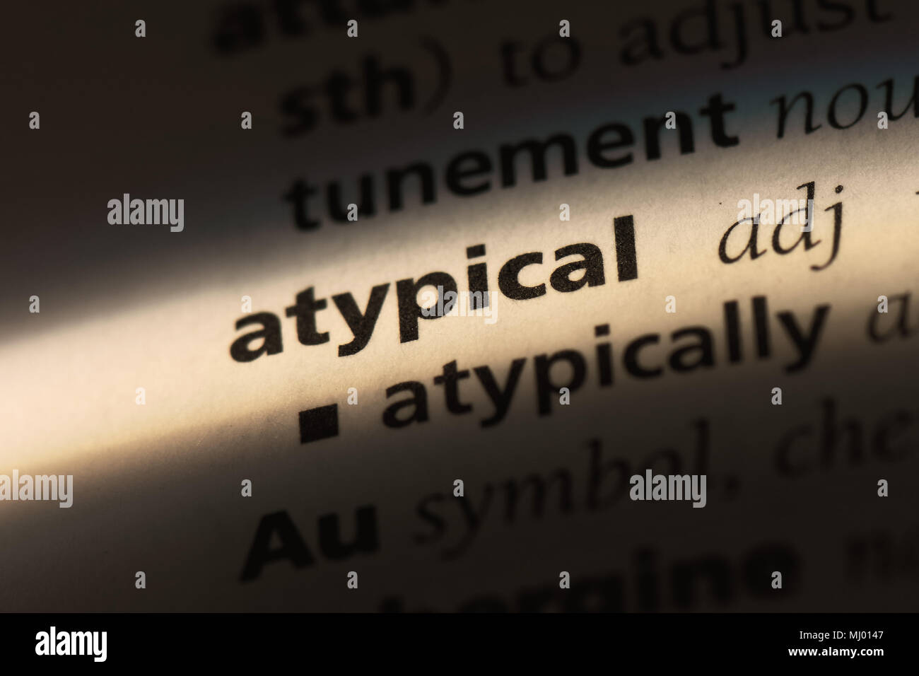 atypical word in a dictionary. atypical concept Stock Photo - Alamy