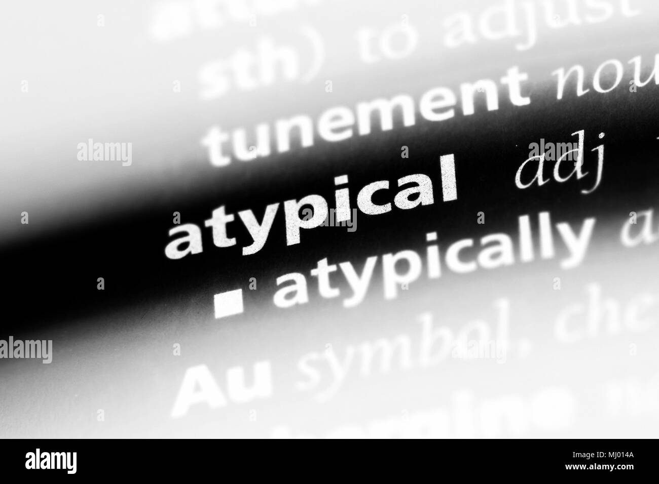 atypical word in a dictionary. atypical concept Stock Photo - Alamy