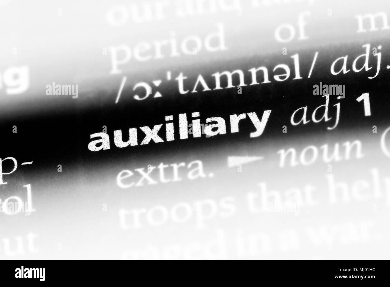 auxiliary word in a dictionary. auxiliary concept Stock Photo - Alamy
