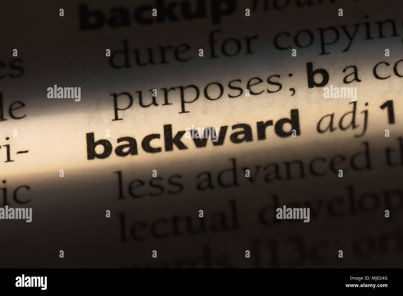 backward word in a dictionary. backward concept Stock Photo - Alamy