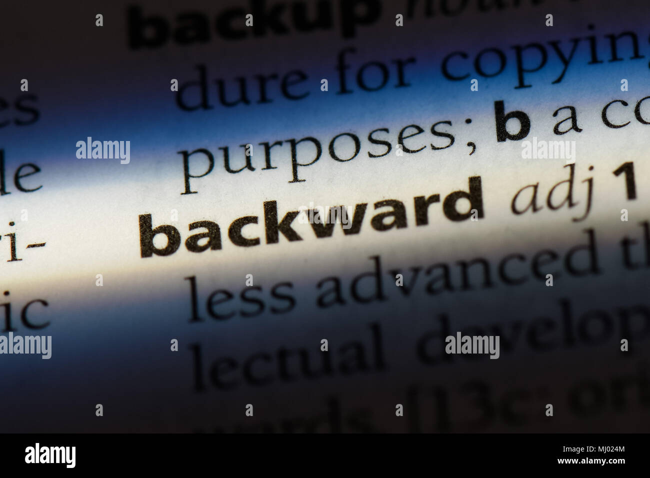 backward word in a dictionary. backward concept Stock Photo - Alamy