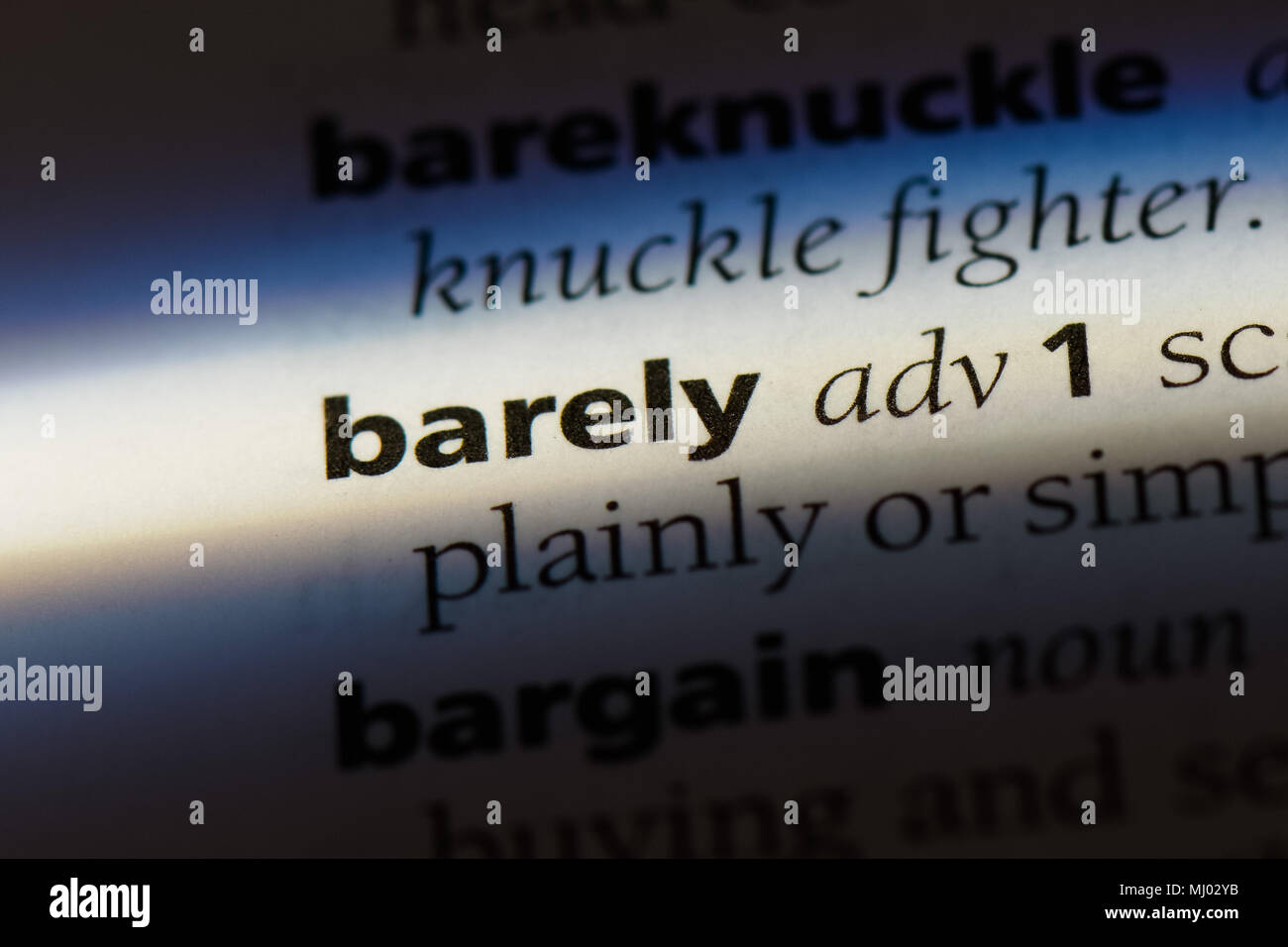 barely word in a dictionary. barely concept Stock Photo - Alamy