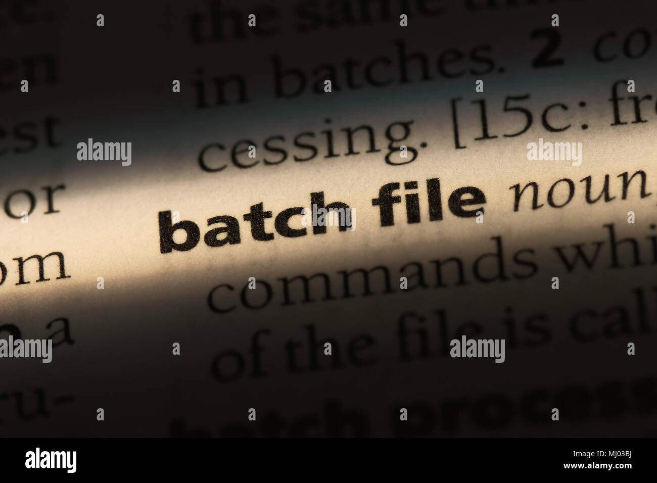 batch file word in a dictionary. batch file concept Stock Photo - Alamy