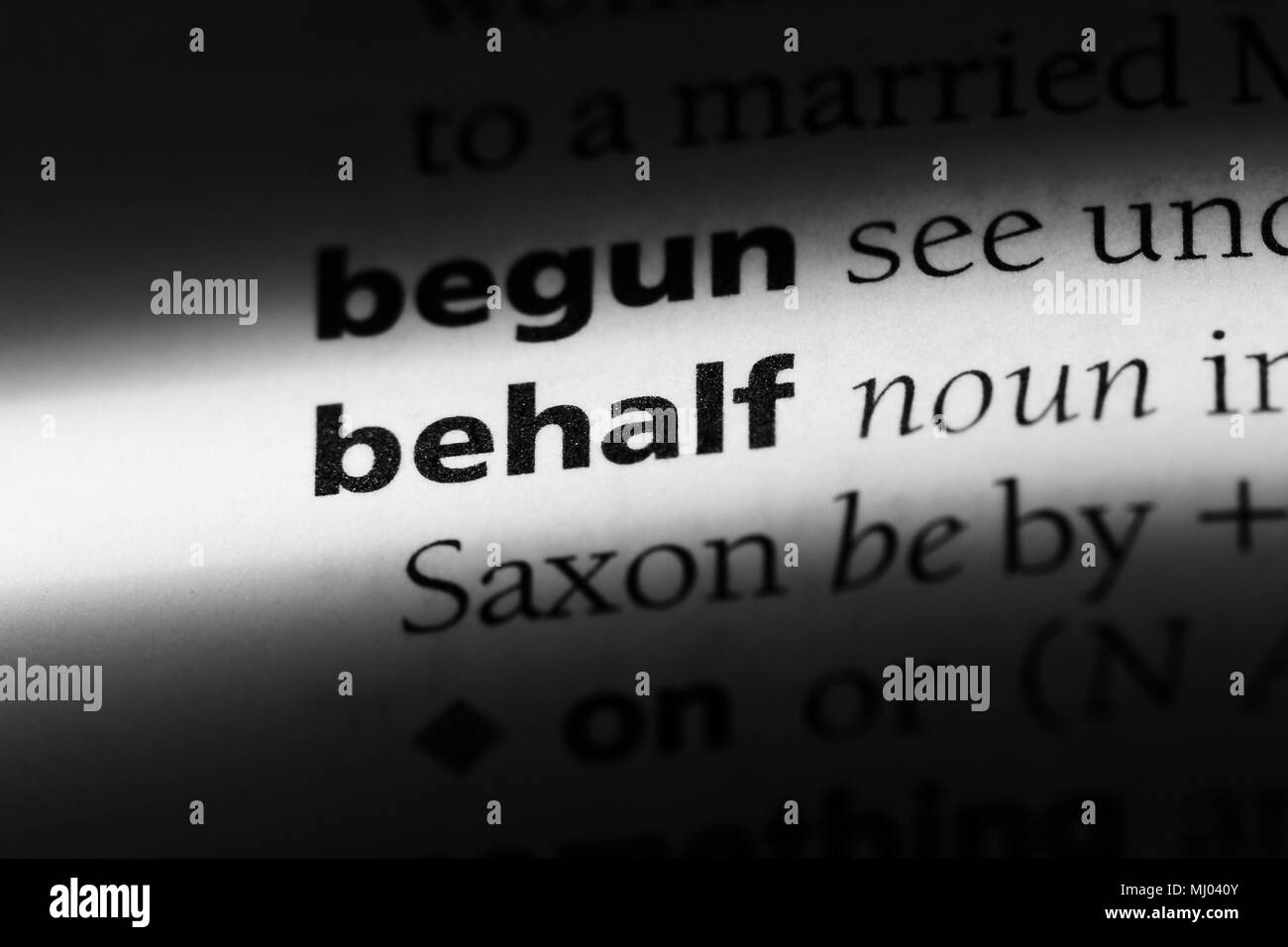 behalf word in a dictionary. behalf concept Stock Photo - Alamy