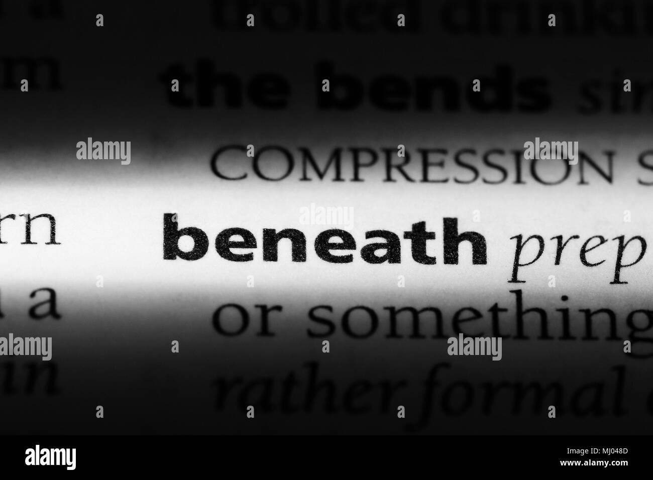 beneath word in a dictionary. beneath concept Stock Photo - Alamy