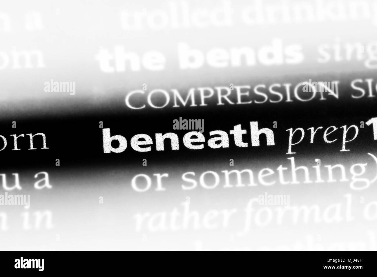 beneath word in a dictionary. beneath concept Stock Photo - Alamy