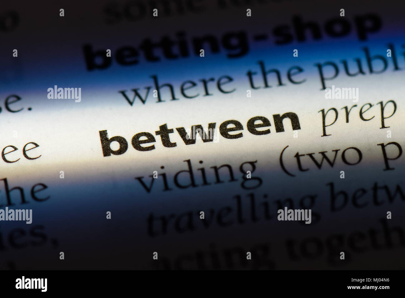 between word in a dictionary. between concept Stock Photo - Alamy