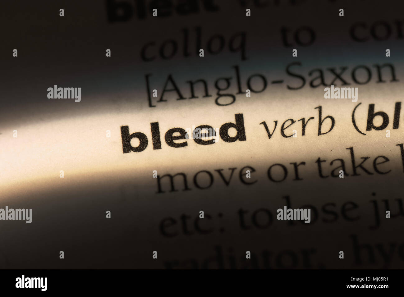 bleed word in a dictionary. bleed concept Stock Photo - Alamy