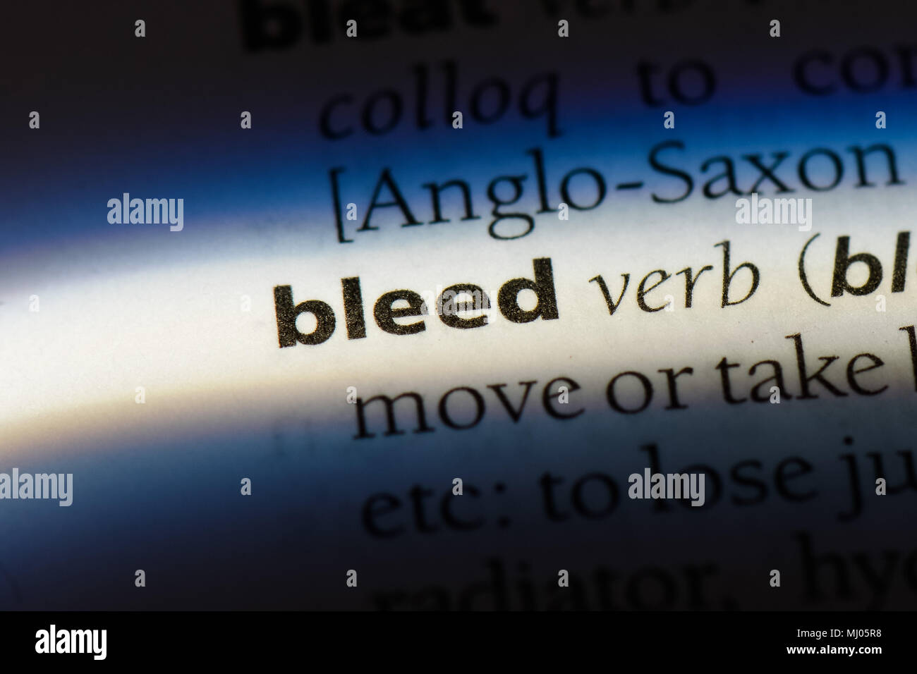 bleed word in a dictionary. bleed concept Stock Photo - Alamy