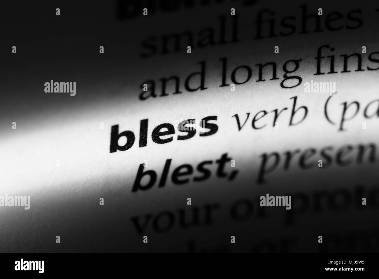 bless word in a dictionary. bless concept Stock Photo - Alamy