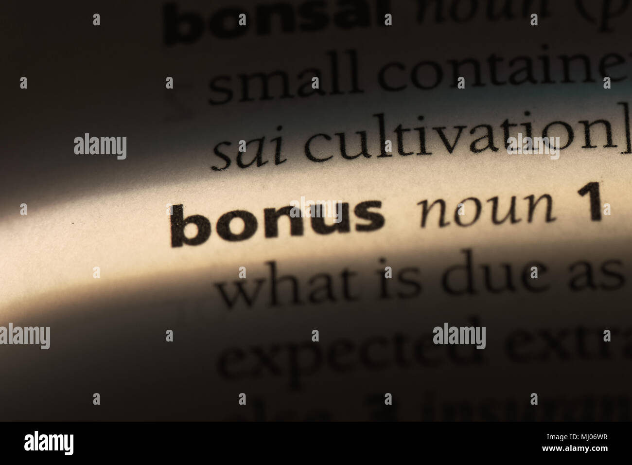 bonus word in a dictionary. bonus concept Stock Photo - Alamy