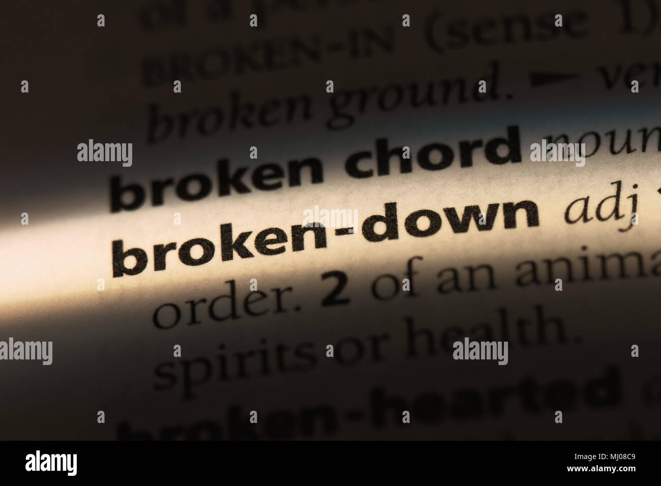 broken-down word in a dictionary. broken-down concept Stock Photo - Alamy