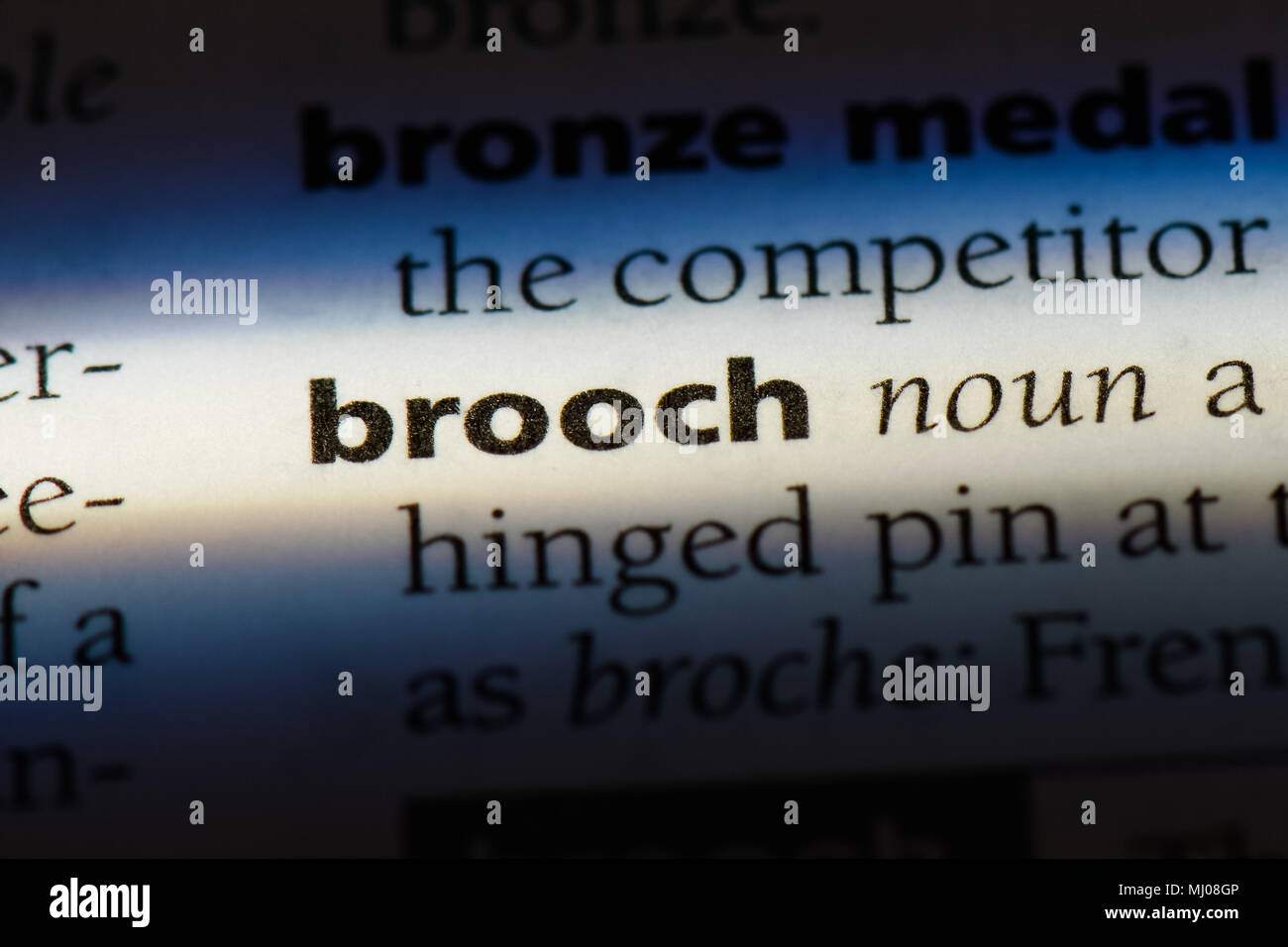brooch word in a dictionary. brooch concept Stock Photo - Alamy