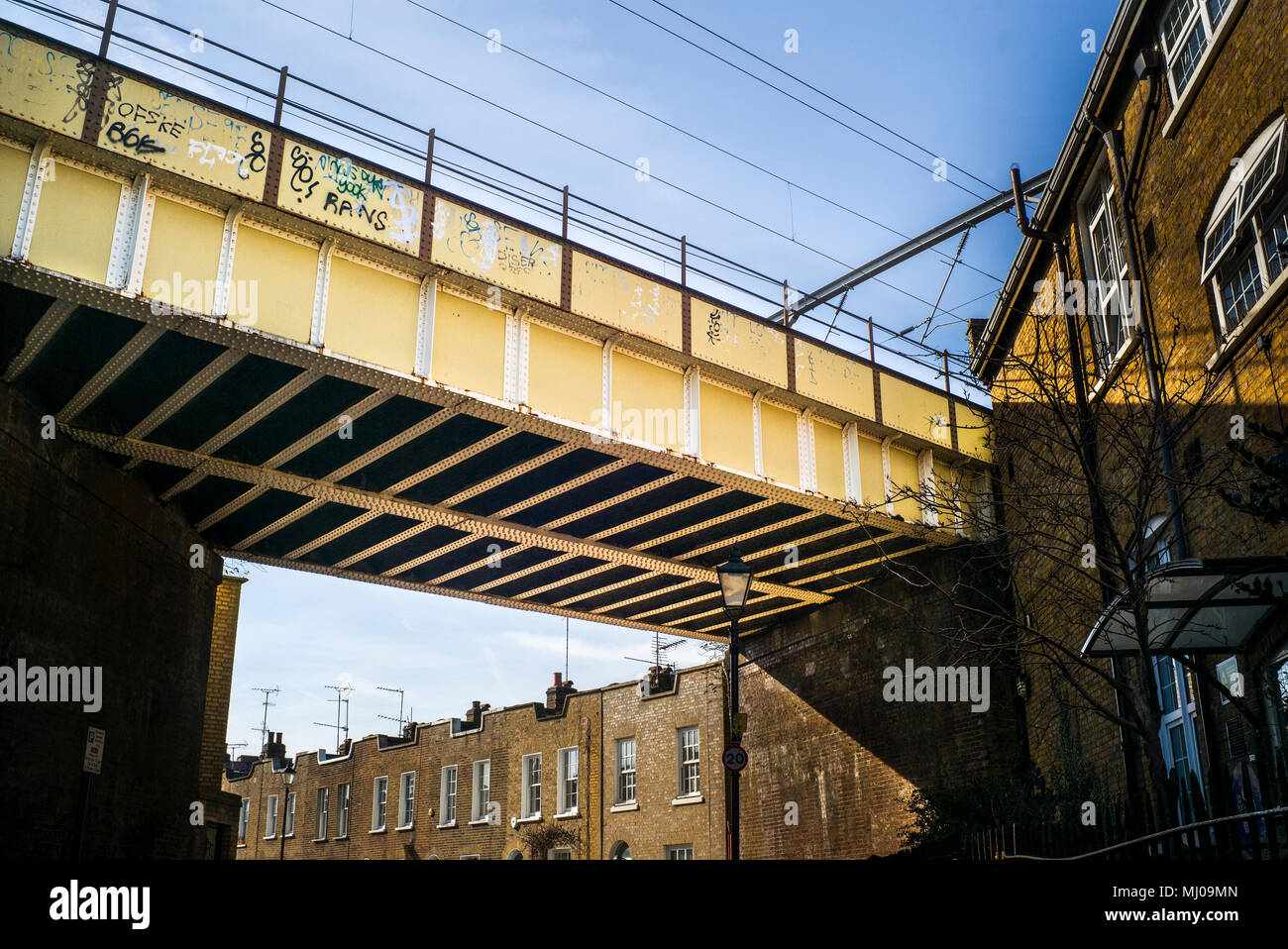 Steel Victorian Yellow Painted Railway Bridge Stretching Between ...