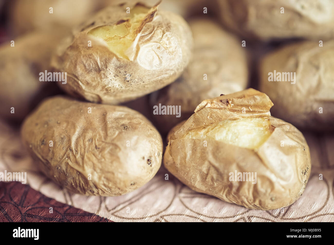 whole potatoes baked in their skins Stock Photo - Alamy