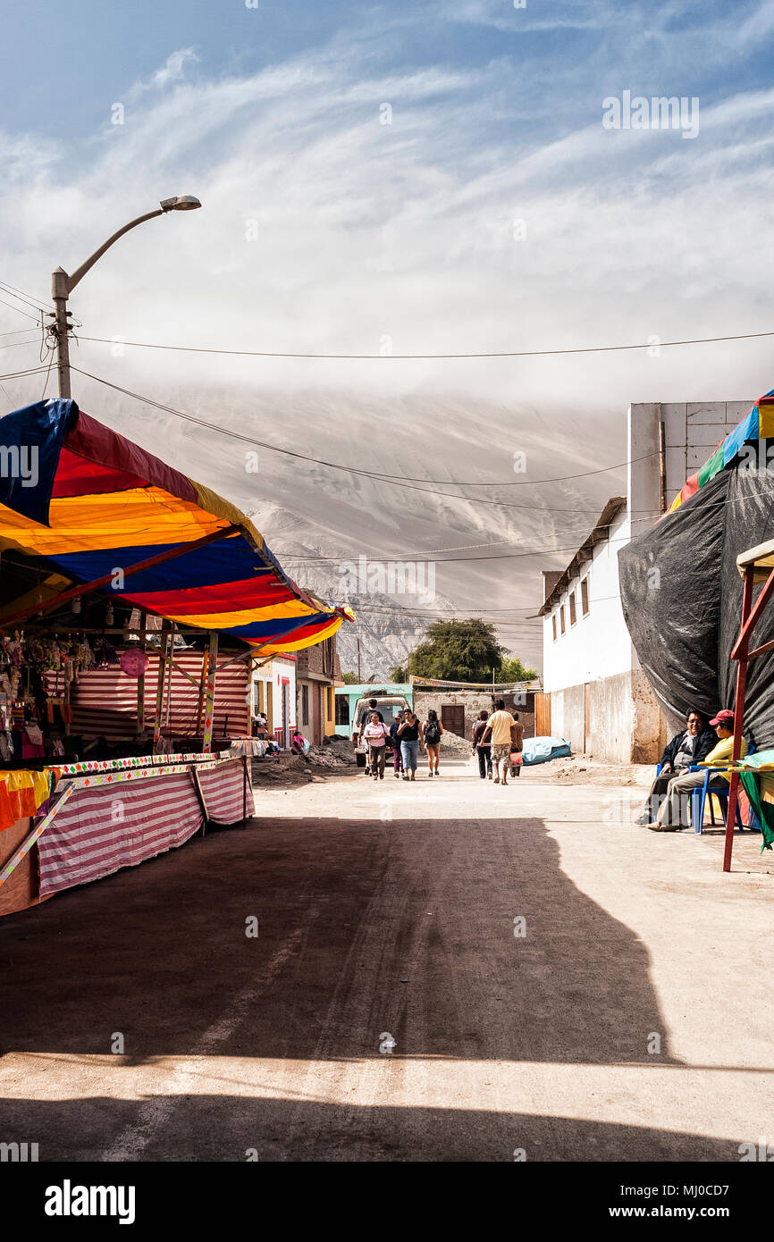 View of a dirt street and Cerro Toro Mata in the background. Acari ...