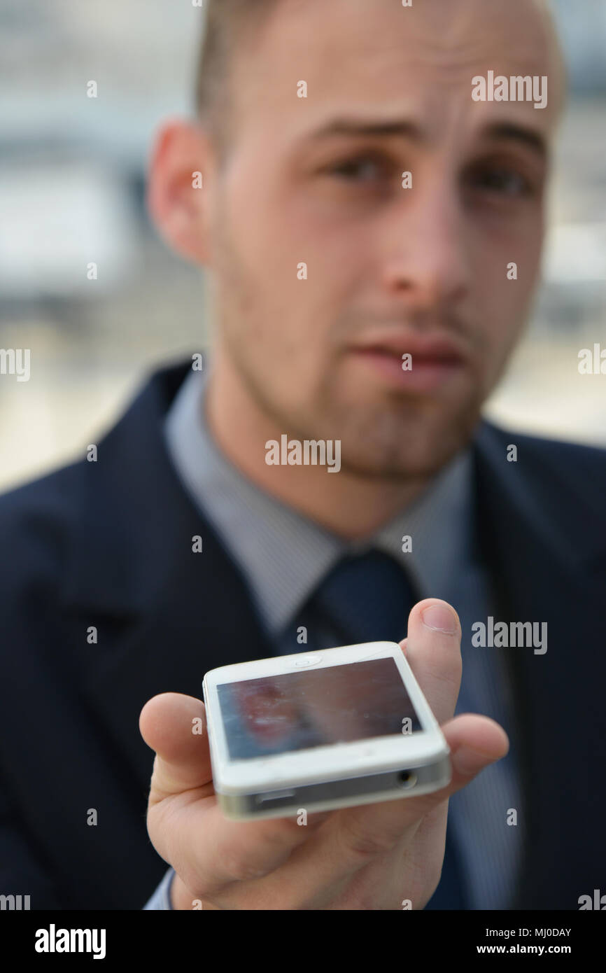 Holding smartphone face hi-res stock photography and images - Alamy