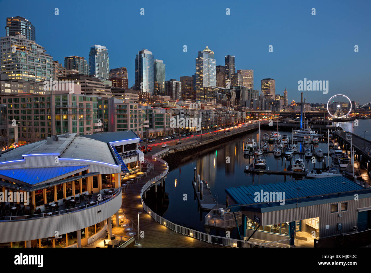 WA15325-00...WASHINGTON - Night settling over the Seattle Waterfront ...