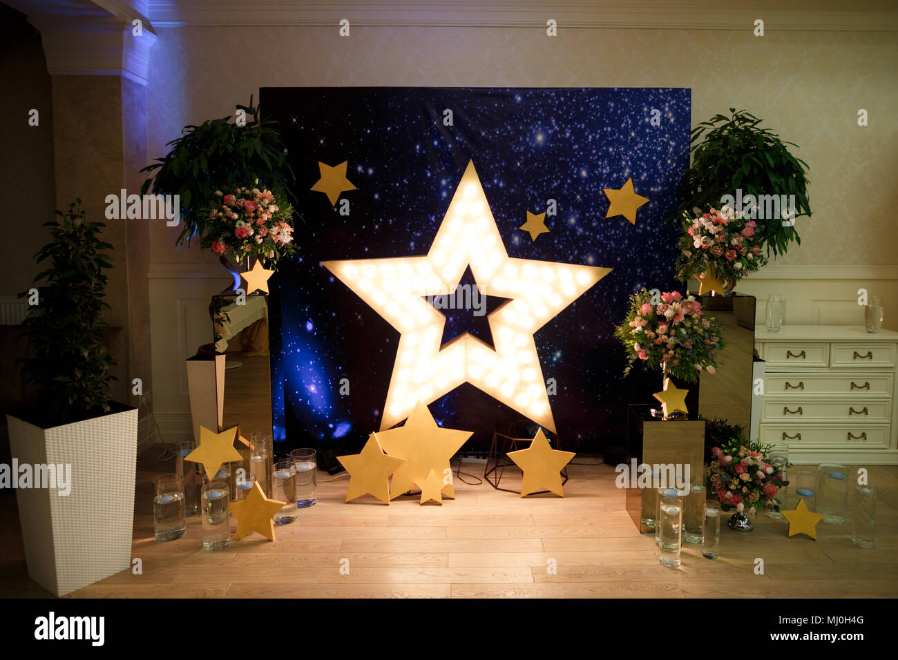 Decorative star with lamps on a background of wall. Modern grungy ...