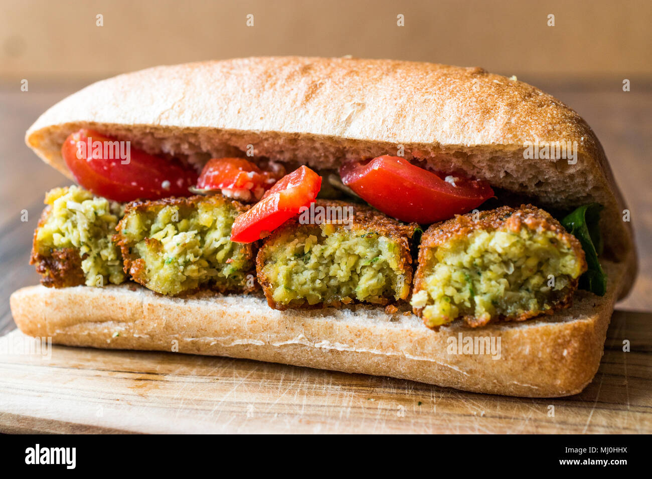 Chickpea Falafel Sandwich with Tomatoes and Sauce. Traditional Food ...